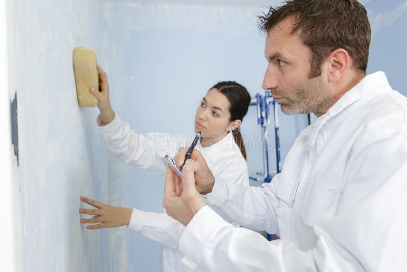 Apprentice Plasterer Sanding Wall Stock Image - Image of smooth ...