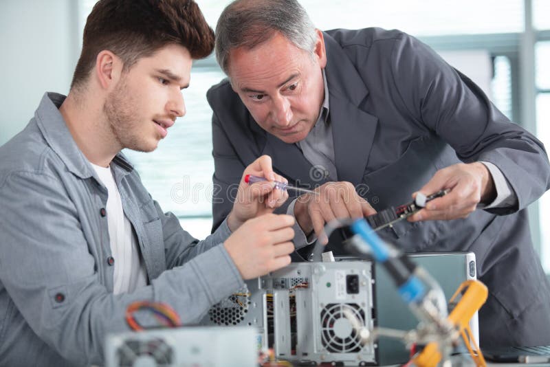 Apprentice Repairing Computer in Technical School Stock Image - Image ...