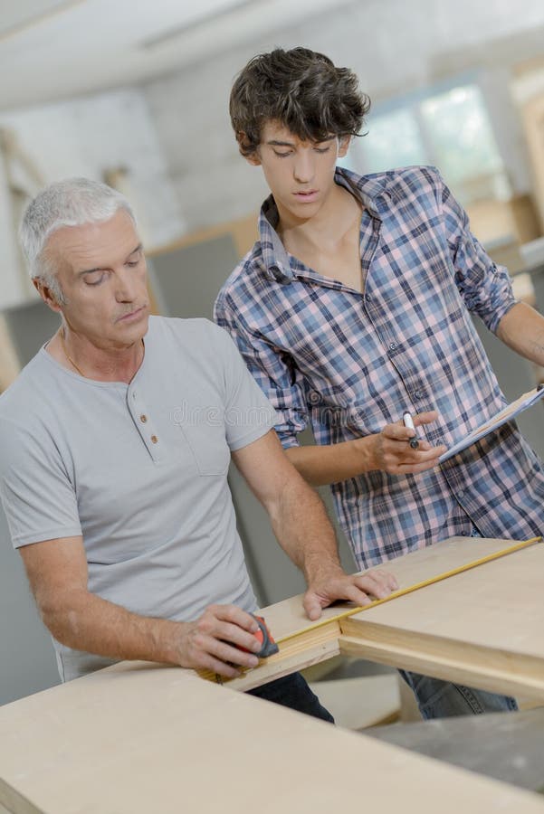 Apprentice taking notes stock photo. Image of manual - 264391580