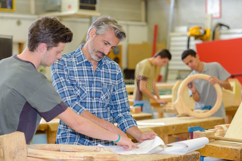 Apprentice- Teacher - Wood Craft Class Stock Photo - Image of teaching ...