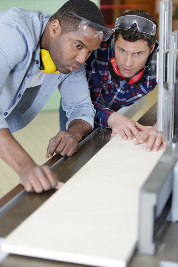 Apprentice Tradesman Learning Under Supervision Stock Photo - Image of ...