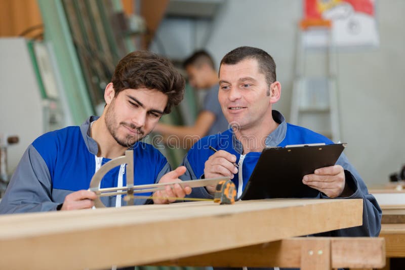 Apprentice or Trainee Beeing Tested by Craftsman Stock Image - Image of ...