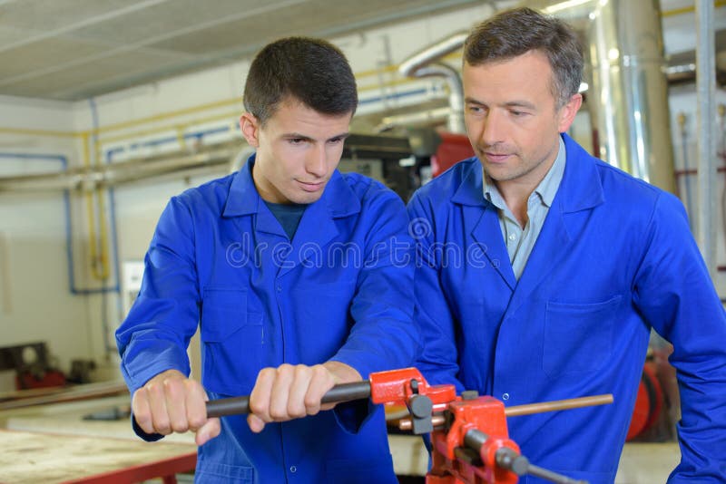 Apprentice using vise stock image. Image of machine - 237592531