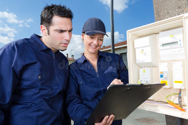 Apprentice at Work with Engineer Outdoors Stock Image - Image of site ...