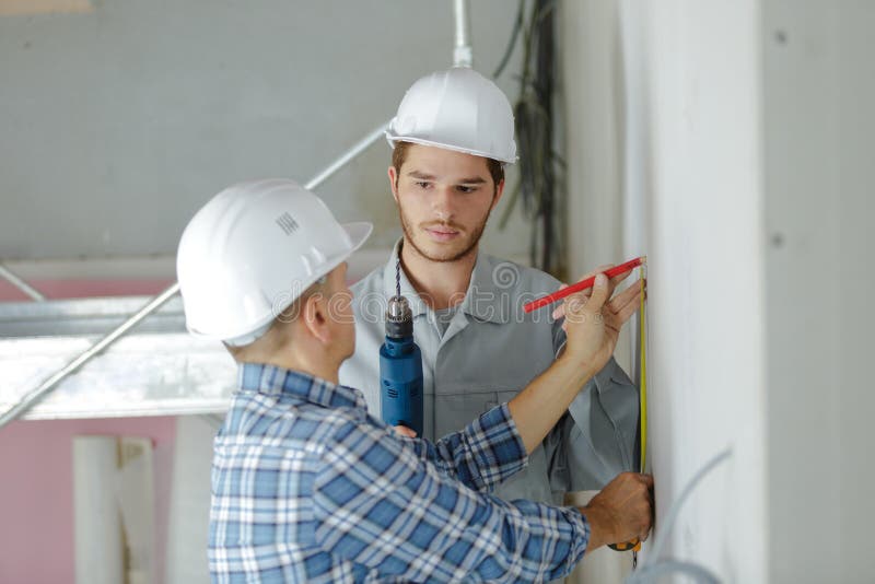 Apprentice Worker Learning Trade with Professor Stock Photo - Image of ...