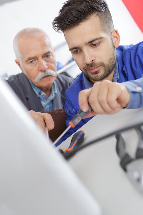 Apprentice Working on Machine Part Stock Image - Image of work ...