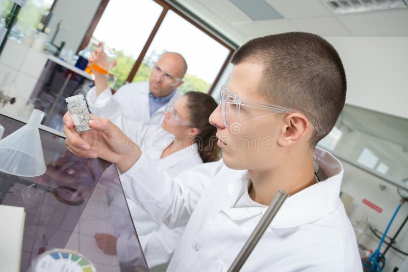 Apprentices and Curiosity at Work Stock Photo - Image of young ...