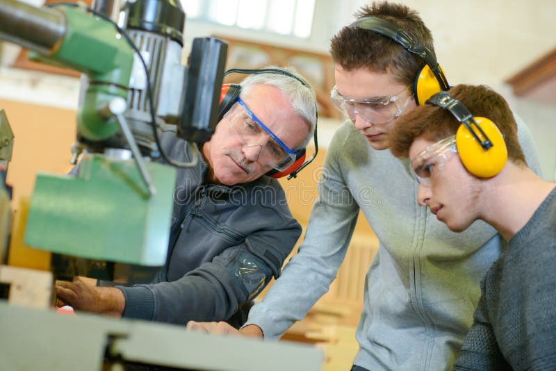 Apprentices Learning To Use Industrial Machine Stock Photo - Image of ...