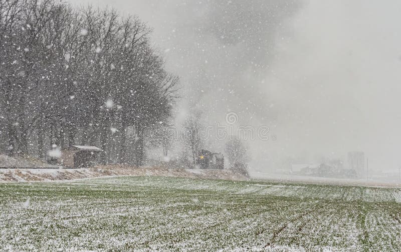 Approaching Stem Passenger Train, in a Snow Storm, Blowing Black and ...