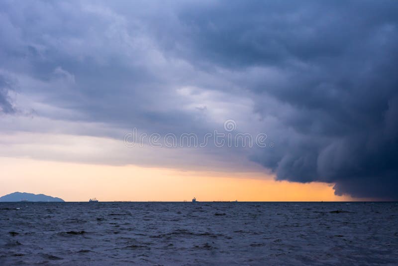 Approaching Storm Cloud with Rain Over the Sea Stock Photo - Image of ...