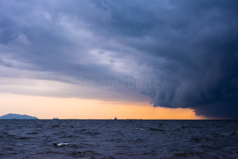 Approaching Storm Cloud with Rain Over the Sea Stock Photo - Image of ...