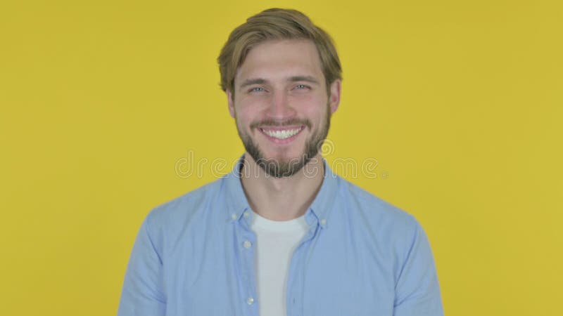 Approval by Young Man, Shaking Head on Yellow Background Stock Image ...