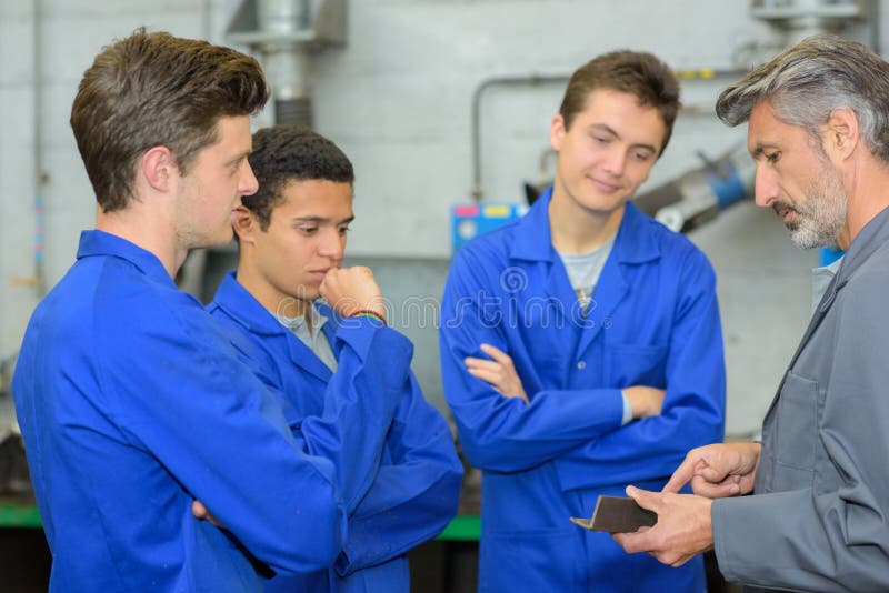 Aprendices Hombres En Overalls Imagen de archivo - Imagen de supervisor ...