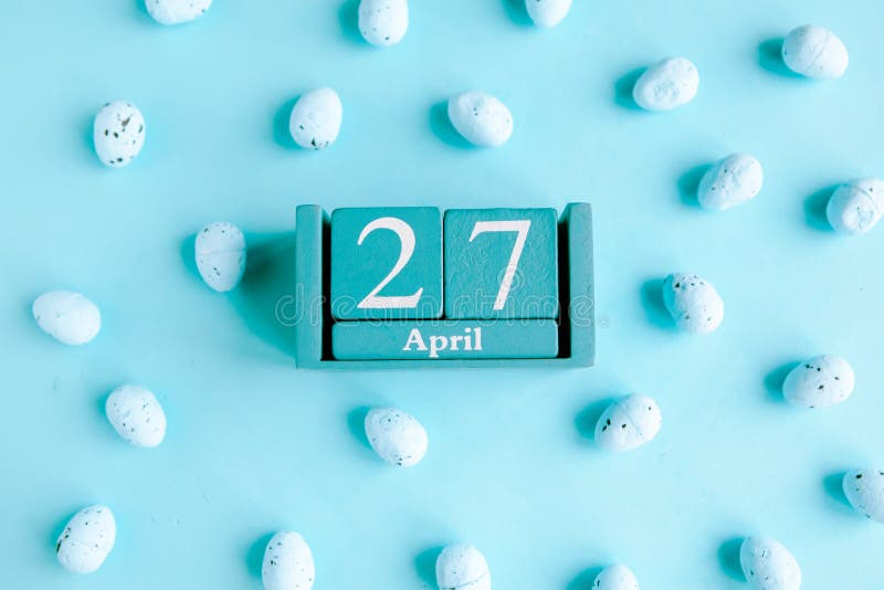 April 14. Blue Cube Calendar with Month and Date on Blue Background ...