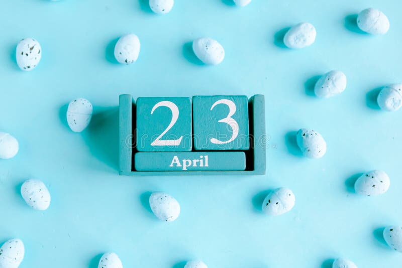 April 23. Blue Cube Calendar with Month and Date on Blue Background ...