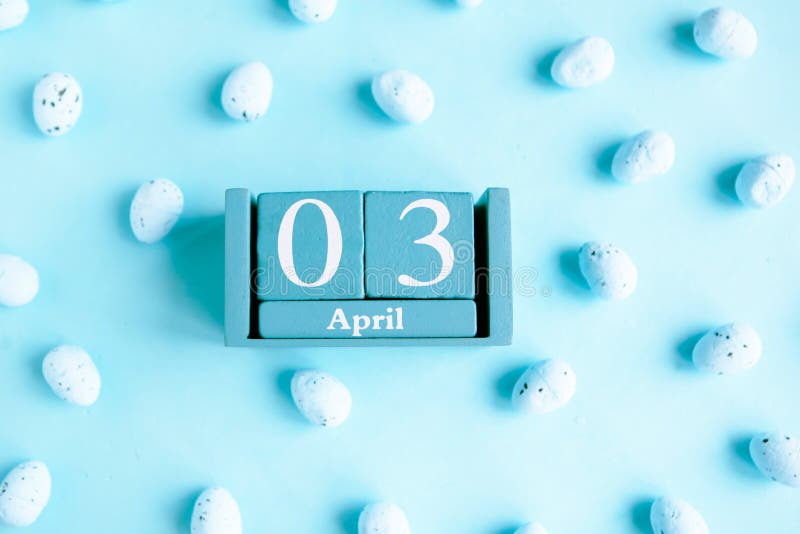 April 3. Blue Cube Calendar with Month and Date on Blue Background ...