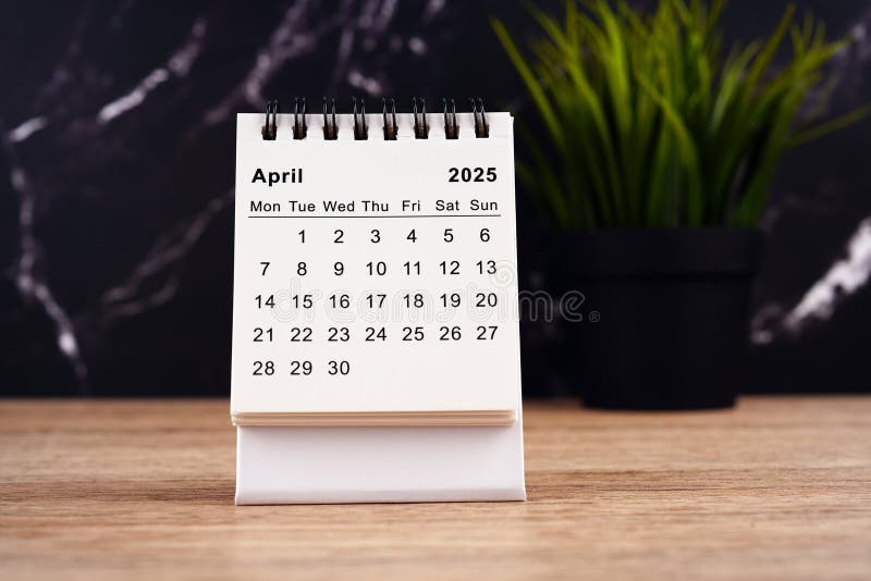 April 2025 Calendar Notepad on the Table with Black Marble Pattern ...