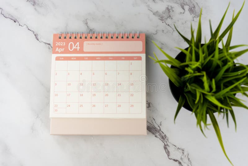 April 2023 Desk Calendar on Marble Table Flat Lay with Potted Plant ...