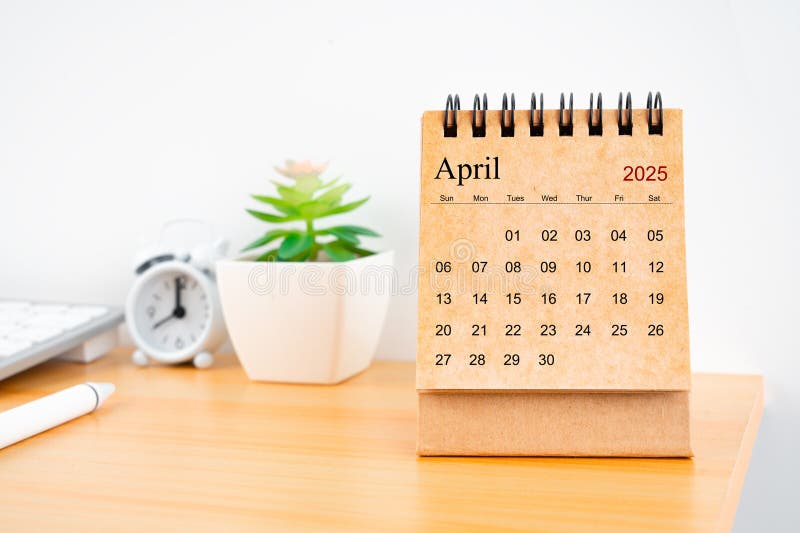 April 2025 Desk Calendar on Worktable Stock Image - Image of design ...
