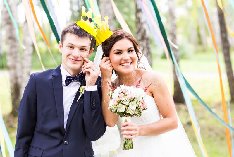 April Fools Day. Wedding Couple Posing with Crown, Mask. Stock Photo ...