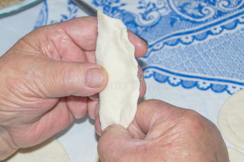 April 19, 2017: Hands of an Man Making Pierogies with Meat. Stock Image ...
