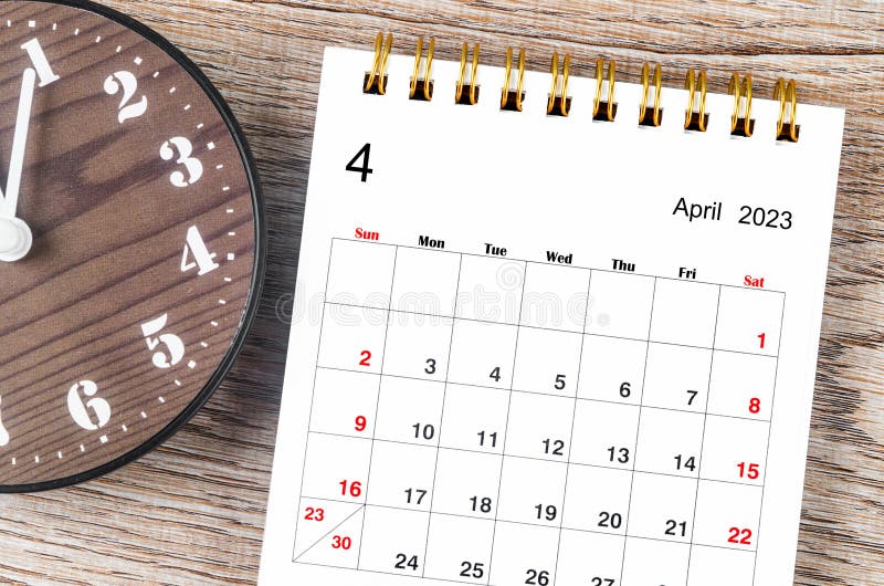 The April 2023 Monthly Desk Calendar for 2023 Year with Clock Stock ...