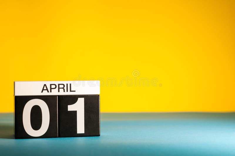 April 1st. Day 1 of April Month, Calendar on Table with Yellow ...