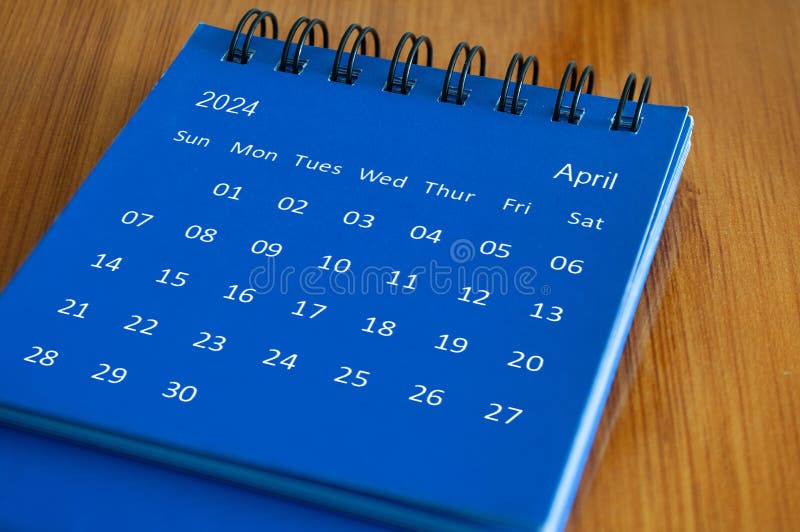 April 2024 Table Calendar on Wooden Desk. Time and Calendar Concept ...