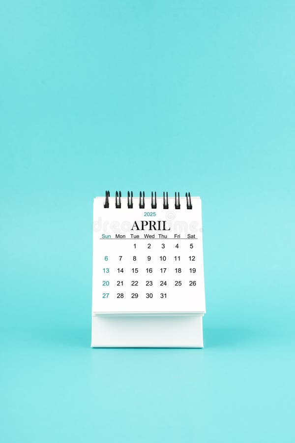 April 2025 White Desk Calendar on Blue Background Stock Image - Image ...