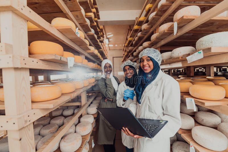Arab Business Partners Checking the Quality of Cheese in the Industry ...