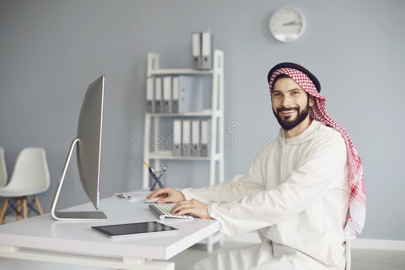 Arab Businessman Worker Works in Computer on the Workplace in the ...