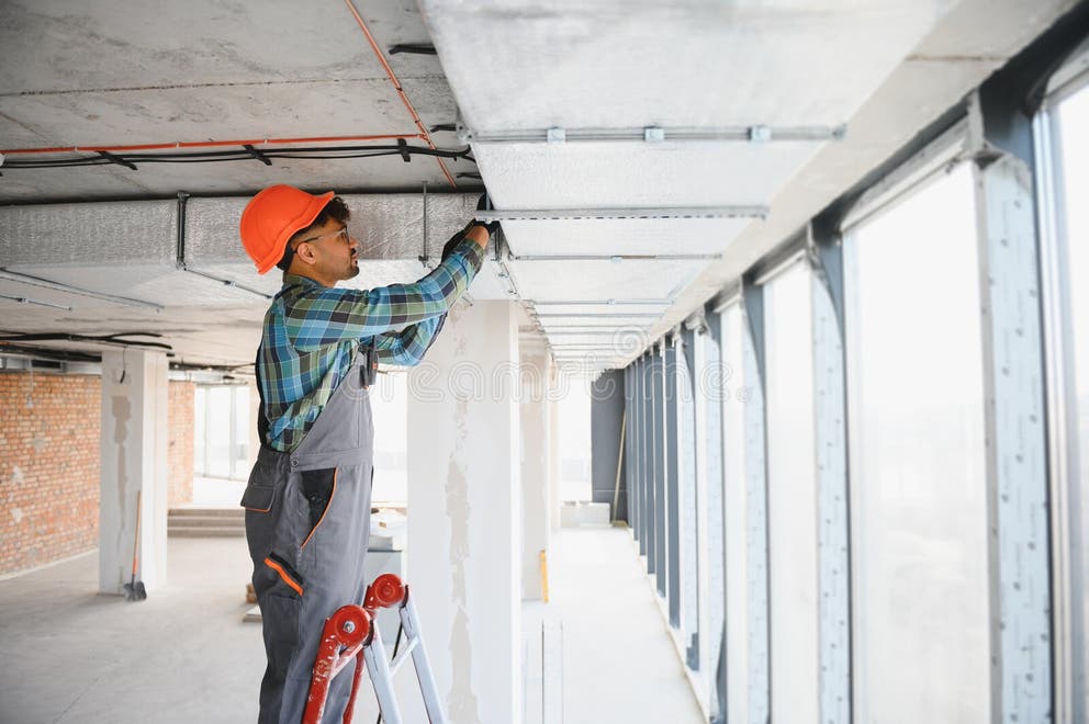 Arab Engineer Installing Ventilation System on Construction Site. Stock ...