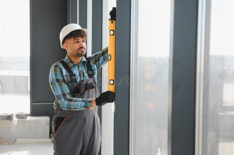 Arab Engineer Using Spirit Level on Construction Site Window Frame ...