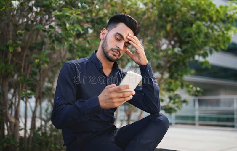 Arab Entrepreneur Man Texting on Cellphone Expressing Unhappiness on ...