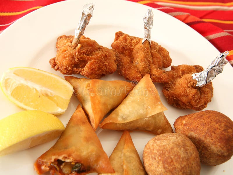 Arab Kubbe Samosas and Chicken Wings Stock Photo - Image of wedge ...
