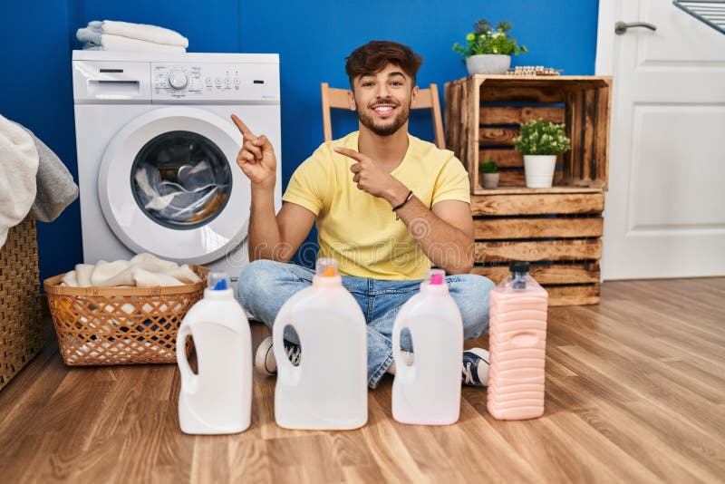 Arab Man with Beard Doing Laundry Sitting on the Floor with Detergent ...