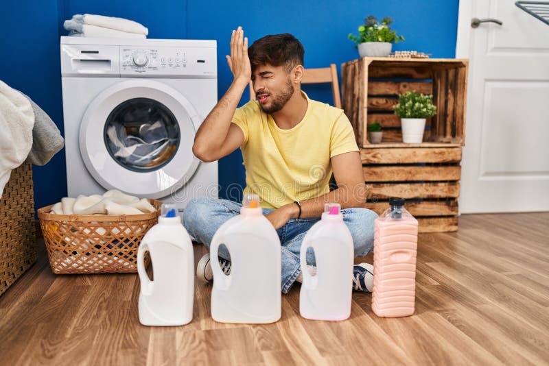 Arab Man with Beard Doing Laundry Sitting on the Floor with Detergent ...