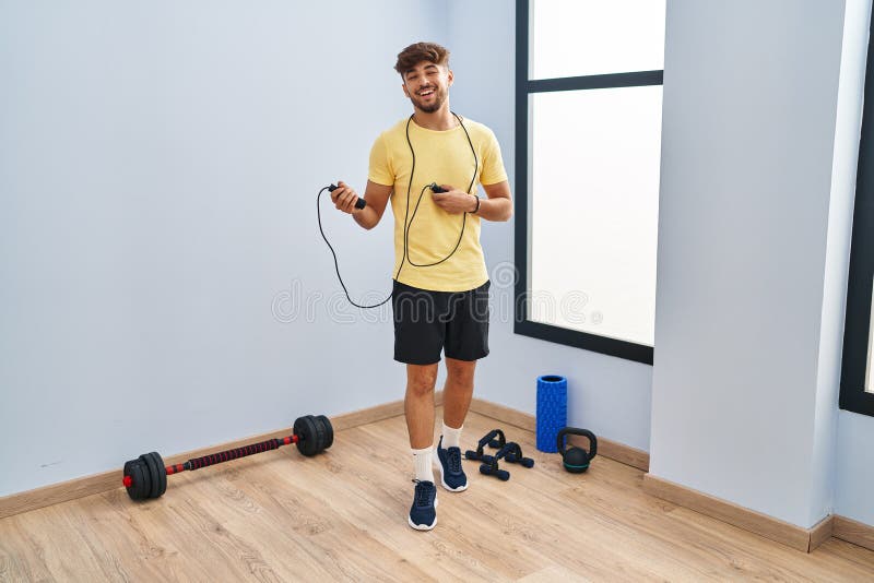 Arab Man with Beard Training with Jump Rope Smiling and Laughing Hard ... Arab Man with Beard Training with Jump Rope Smiling and Laughing Hard ...