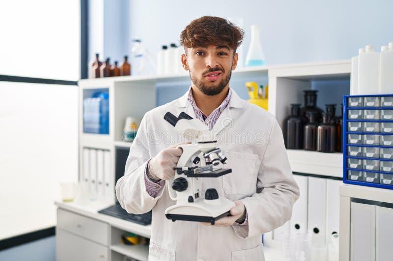 Arab Man with Beard Working at Scientist Laboratory Holding Microscope ...