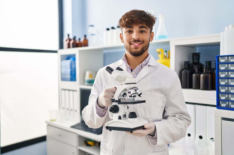Arab Man with Beard Working at Scientist Laboratory Holding Microscope ...