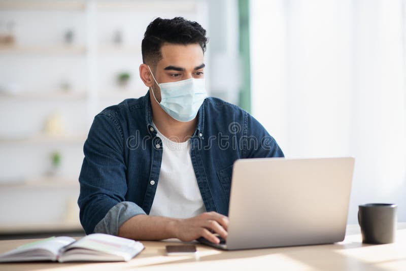 Arab Man in Protective Face Mask Using Laptop Stock Image - Image of ...