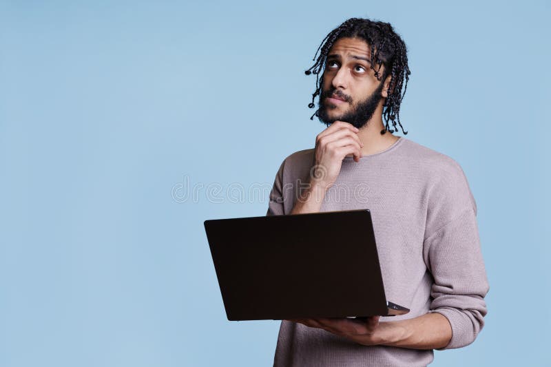 Arab Man Reading Programming Report on Laptop Stock Photo - Image of ...