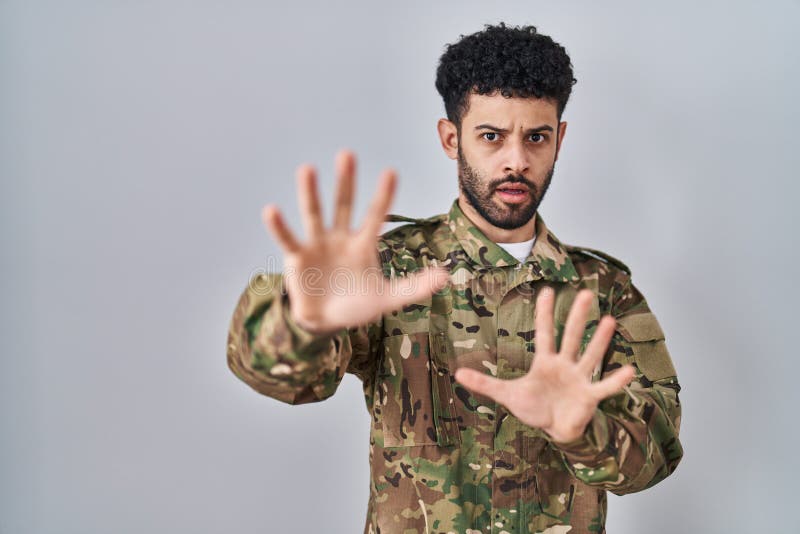 Arab Man Wearing Camouflage Army Uniform Afraid and Terrified with Fear ...