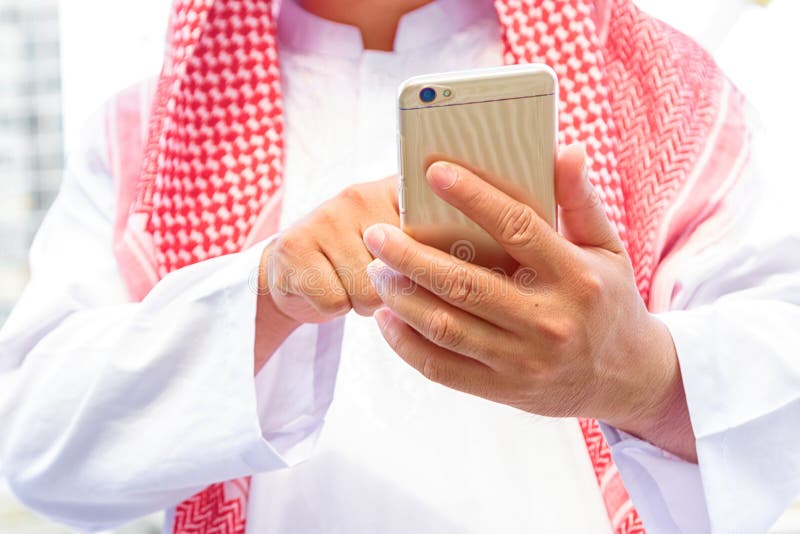 Arab Saudi Emirates Man Hand Texting in a Smart Phone Stock Image ...