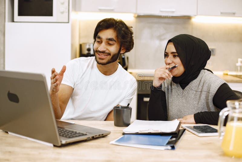 Arab Students Studying and Learning at Home with a Laptop and Notes ...