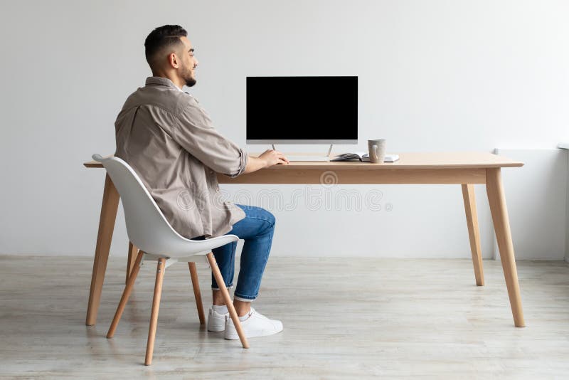 Arab Worker Using Laptop with Black Empty Screen, Mockup Stock Photo ...