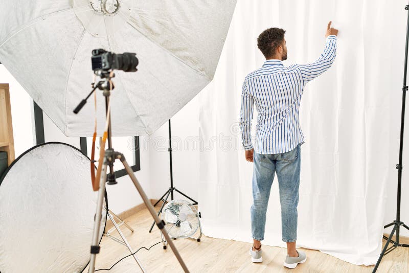 Arab Young Man Posing As Model at Photography Studio Posing Backwards ...