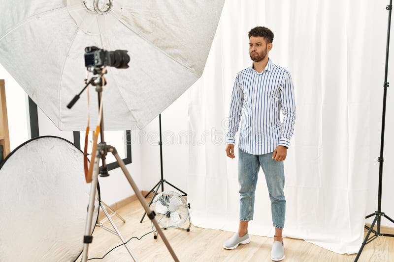 Arab Young Man Posing As Model at Photography Studio Depressed and ...
