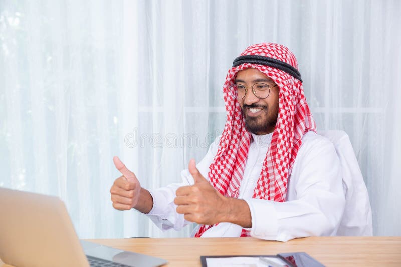 Arabian Businessman is Thinking about His Work in His Office with ...
