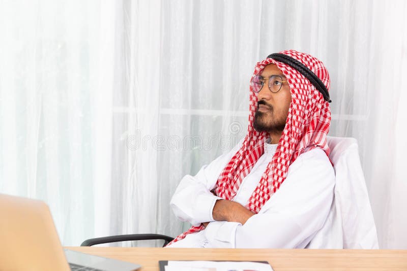 Arabian Businessman is Thinking about His Work in His Office with ...
